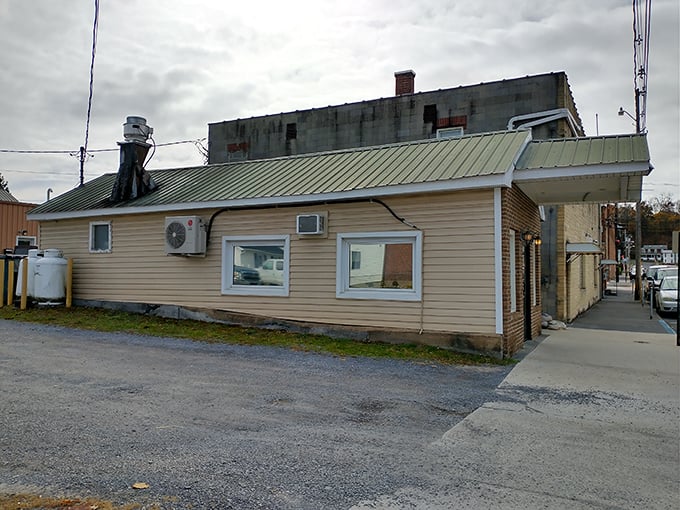 The unassuming exterior of Romney Diner hides culinary treasures that have locals setting their alarms early. Small-town magic at its finest!