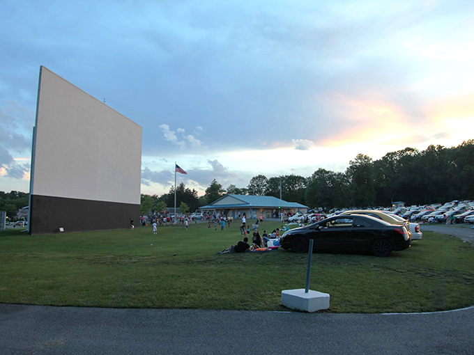 Twilight magic unfolds as the massive screen awaits its first flicker of light. Pennsylvania sunsets provide the perfect opening act for movie night.