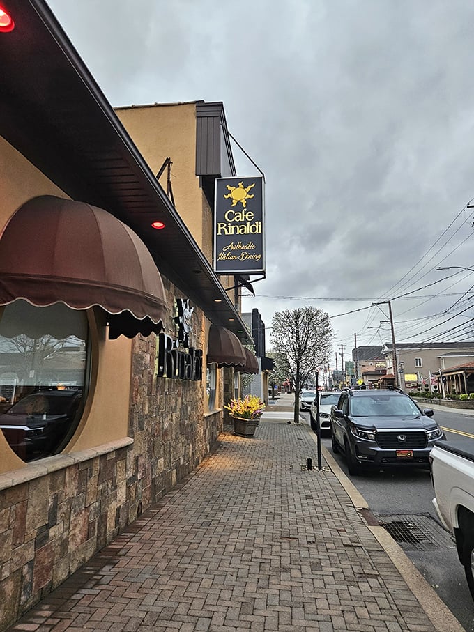The classic stone fa&ccedil;ade and distinctive brown awnings of Caf&eacute; Rinaldi invite you into Old Forge's Italian treasure, promising authentic flavors behind those doors.