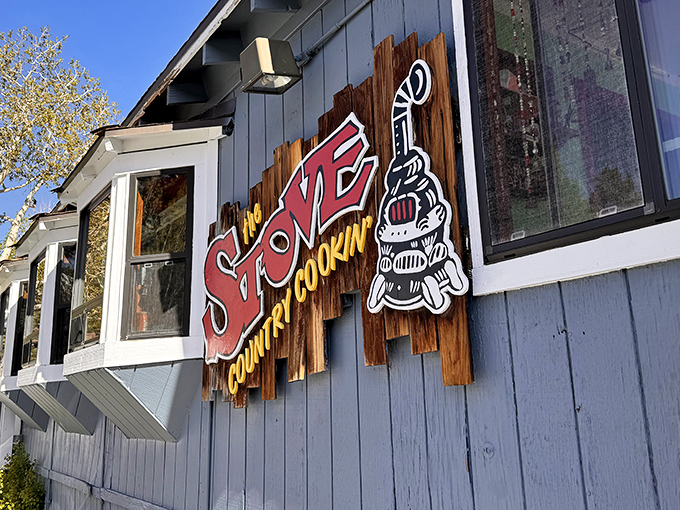 The blue cabin with its rustic wooden "COUNTRY COOKIN'" sign isn't trying to be trendy&mdash;it's too busy being delicious instead.