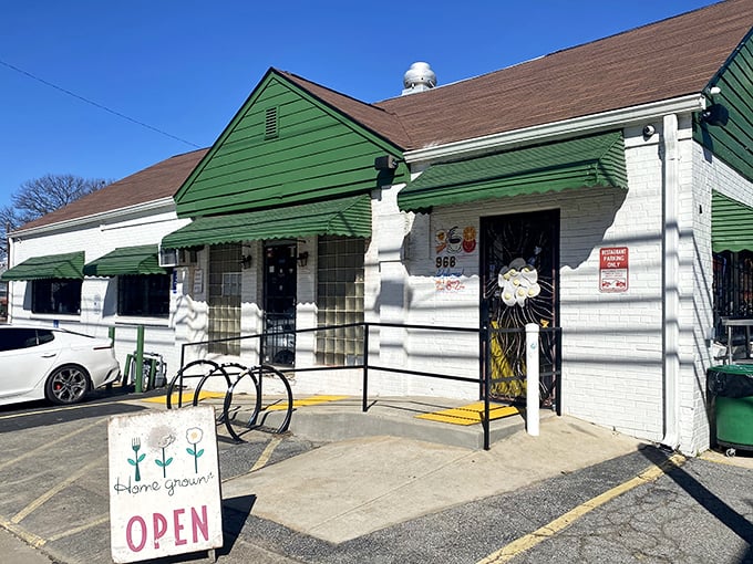 The unassuming green and white exterior of Home Grown GA stands like a culinary lighthouse on Memorial Drive, beckoning hungry travelers with its simple "OPEN" sign.