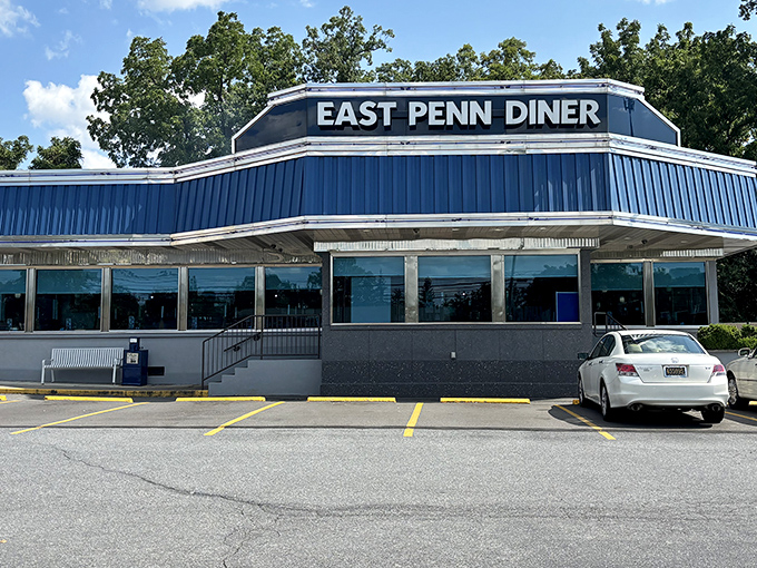 The iconic blue roof of East Penn Diner stands like a beacon of breakfast hope along Chestnut Street. Morning sunshine only enhances its classic American charm.