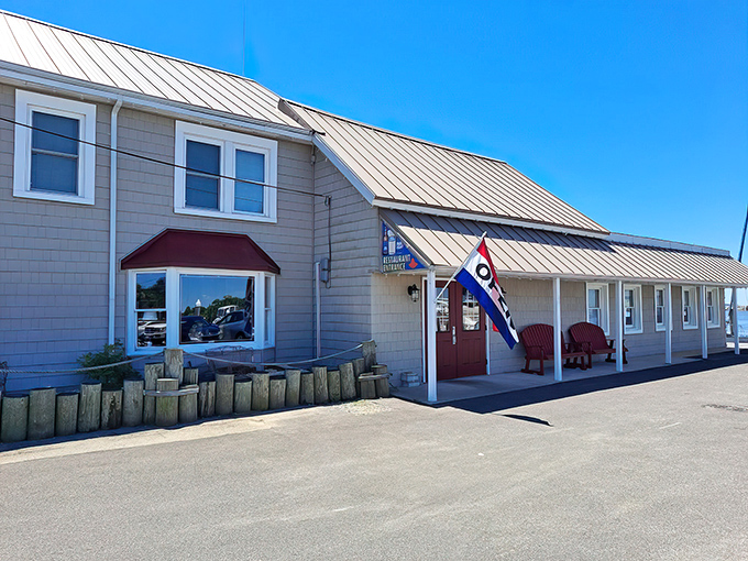 The welcoming exterior of Waterman's Crab House, where maritime charm meets legendary Maryland seafood under perfect Eastern Shore skies.