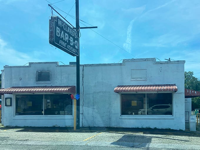 The unassuming white exterior of McClard's hides a barbecue paradise within, like finding a treasure chest disguised as an ordinary box.