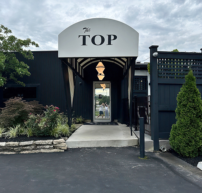 The iconic white marquee of The Top Steak House beckons like a culinary lighthouse, promising refuge from mediocre meals in a sea of chain restaurants.