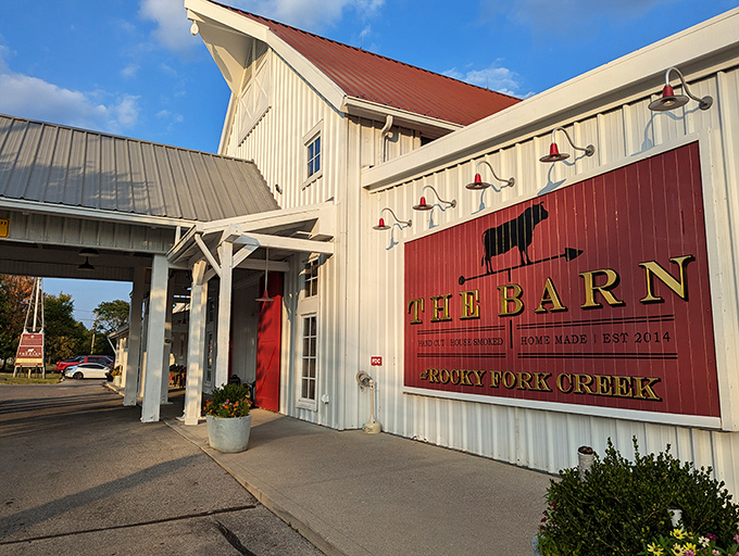 The classic red and white exterior of The Barn at Rocky Fork Creek isn't just farm-chic architecture—it's a promise of the heartland hospitality waiting inside.