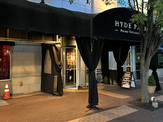 The elegant black awning of Hyde Park Prime Steakhouse beckons like a culinary lighthouse in downtown Pittsburgh, promising refuge from ordinary dining experiences.