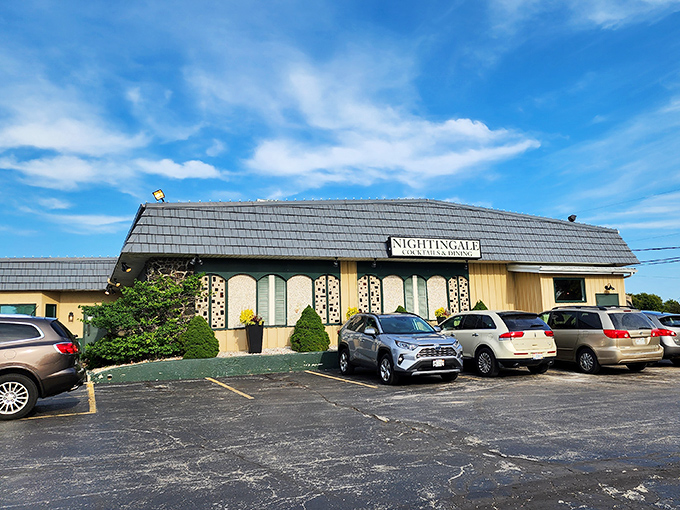 The unassuming exterior of Nightingale Supper Club stands like a time capsule under Wisconsin skies, promising culinary treasures within.