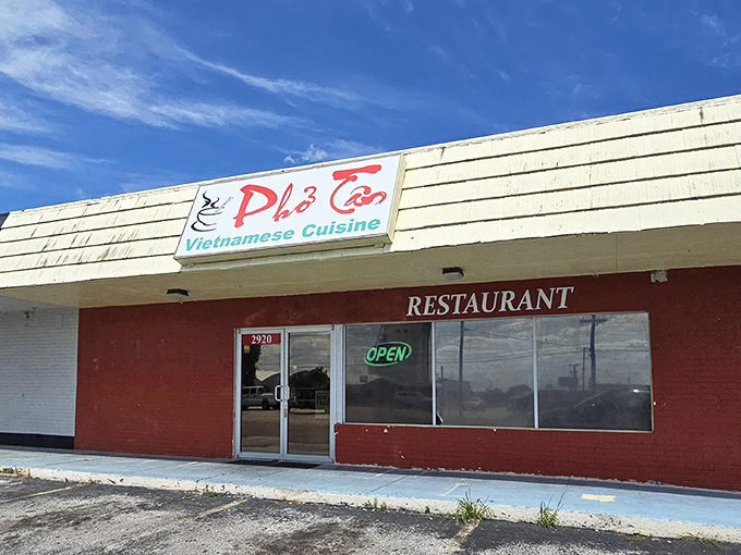 That red brick exterior and neon "OPEN" sign are your first clue that something special awaits inside this Lakeland gem.