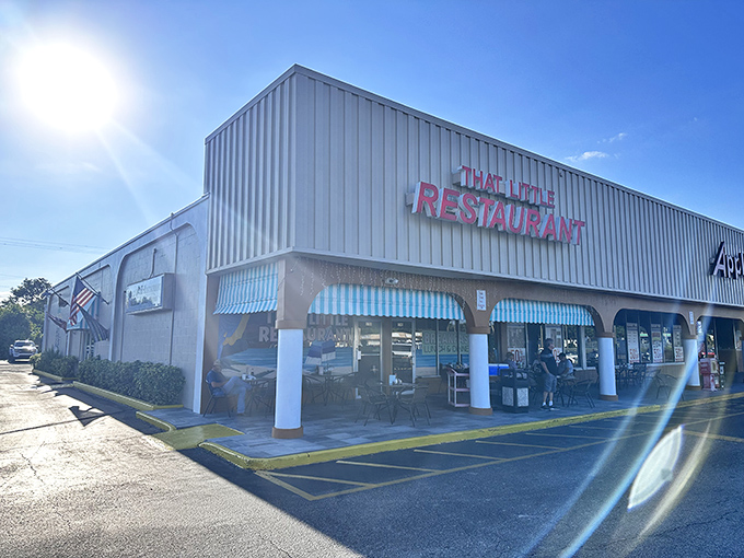 That iconic blue-striped awning isn't just decoration—it's nature's way of saying "breakfast paradise ahead." Welcome to That Little Restaurant in Melbourne.