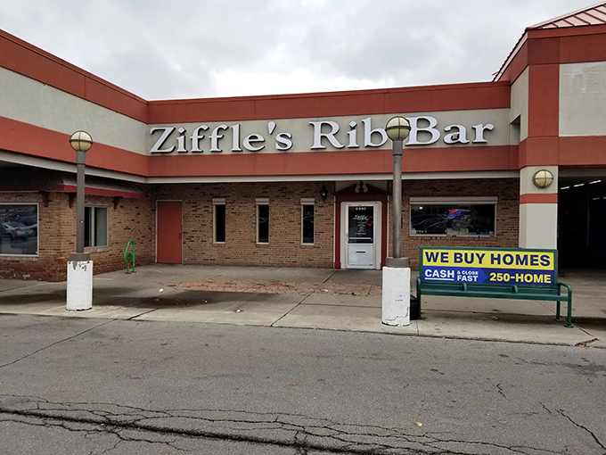 The unassuming exterior of Ziffle's Rib Bar proves once again that barbecue brilliance often hides behind modest facades. Smoke signals of deliciousness await inside.