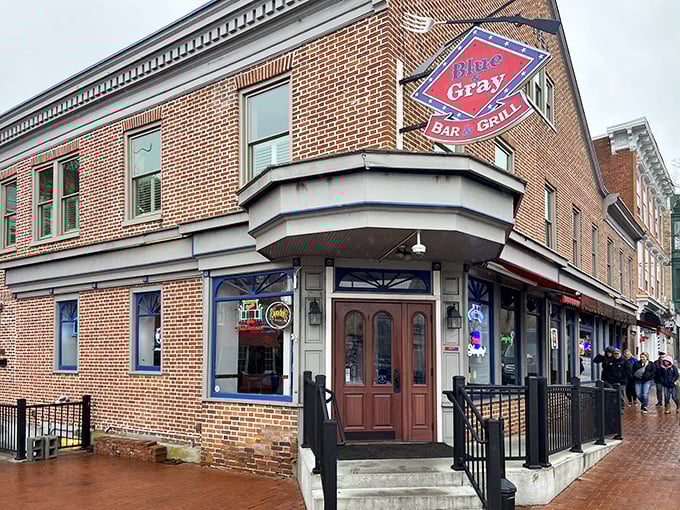 The historic brick exterior of Blue & Gray Bar & Grill stands as a delicious beacon in downtown Gettysburg, where history and hunger happily collide.