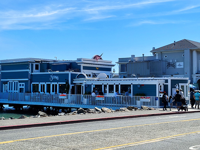 Scoma's blue exterior stands like a maritime beacon on Sausalito's shoreline, promising seafood treasures within those waterfront walls.