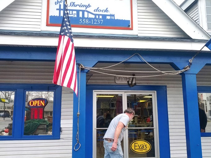 The Shrimp Dock's charming blue-trimmed exterior stands as a beacon of hope for seafood lovers stranded in landlocked Tennessee. Ocean dreams come true here!