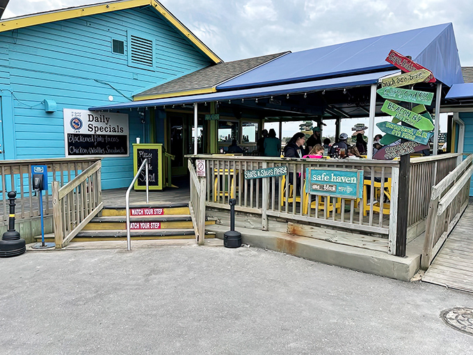 Colorful directional signs point to faraway beaches while you're seated firmly in seafood paradise &ndash; a reminder that sometimes the best destinations are the ones where you're already standing.