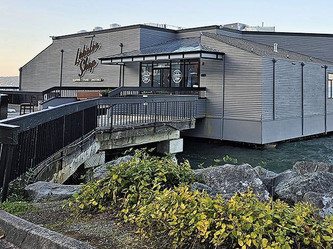 The Lobster Shop sits like a culinary lighthouse on Commencement Bay, promising seafood treasures within its unassuming exterior.