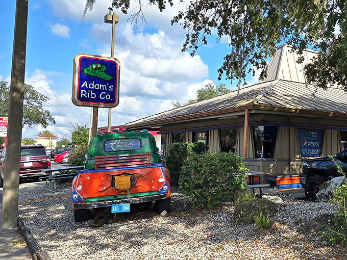 That vintage truck isn't just decoration&mdash;it's a beacon of barbecue hope, painted in Gator colors to let you know you're in Gainesville territory.