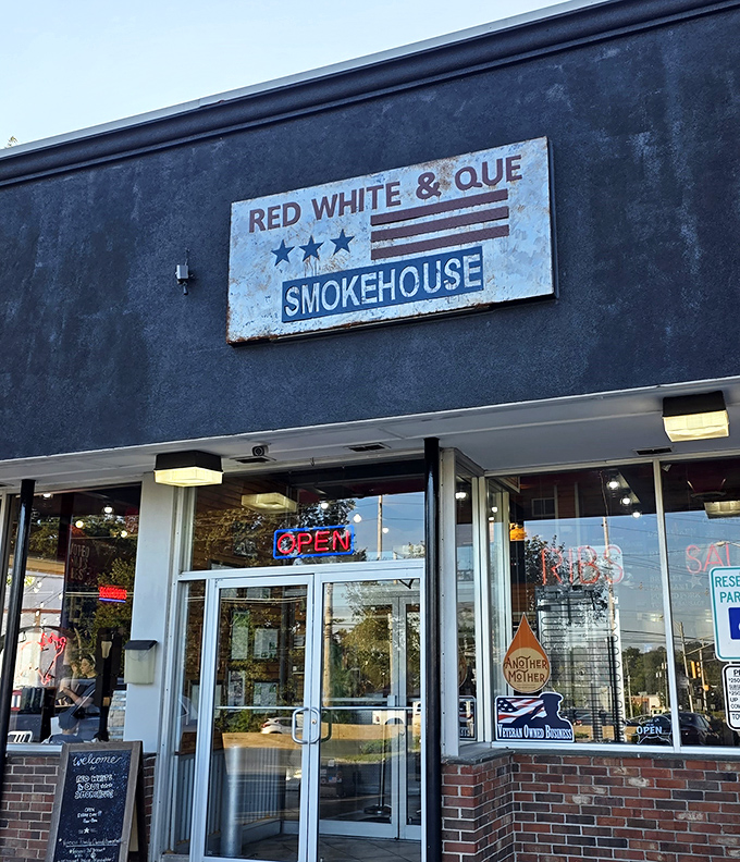 The weathered sign says it all &ndash; authentic barbecue awaits behind these doors. No frills, just smoky promises that make your stomach growl in anticipation.