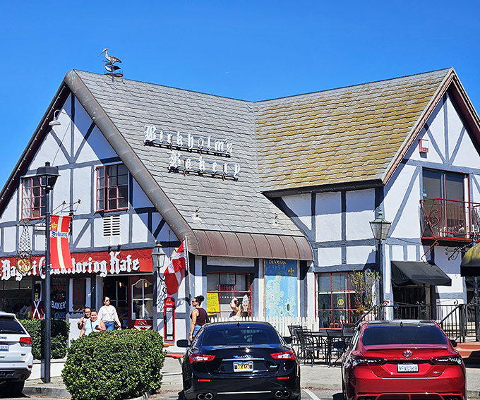 The storybook charm of Birkholm's exterior feels like you've stumbled into a Danish fairy tale, complete with a whimsical bird weathervane keeping watch over pastry paradise.