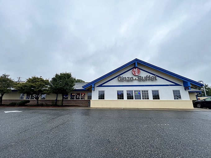 The unassuming exterior of Ginza Buffet proves once again that culinary treasures often hide behind modest facades. Blue trim and a welcoming entrance await.