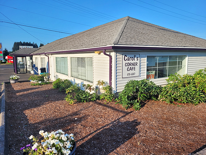 The unassuming exterior of Carol's Corner Cafe hides culinary treasures within. Purple trim and simple landscaping&mdash;like a cozy sweater for your favorite breakfast spot.