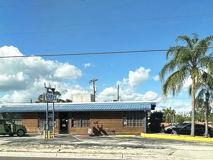 The unassuming wooden exterior of Gary's Oyster Bar might not win architectural awards, but that blue roof signals seafood paradise awaits inside.
