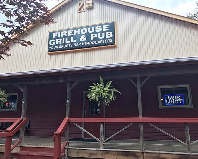 The welcoming exterior of Rootstown Firehouse Grille & Pub, where that signature green sign promises good times and even better food inside.