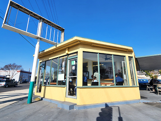 The humble yellow building that launched a thousand breakfast dreams. Corner Cottage's unassuming exterior hides culinary treasures that Burbank residents line up for daily.