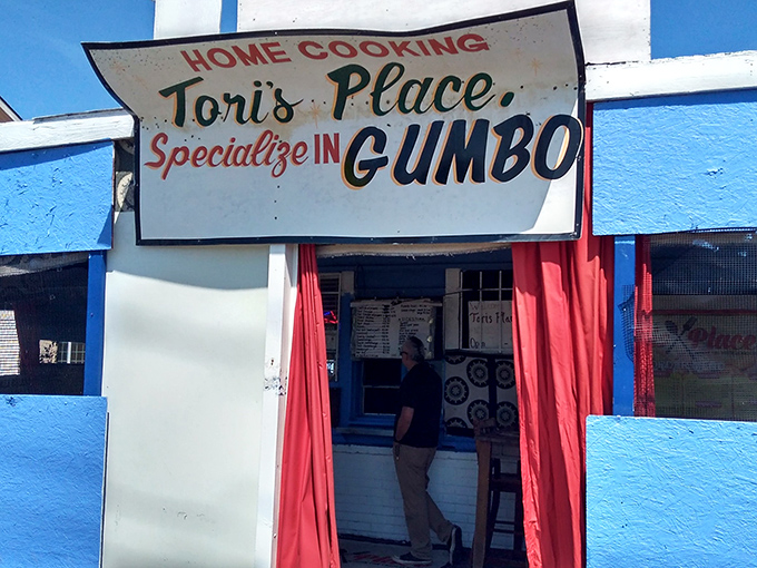 The bright blue exterior with its bold "HOME COOKING" sign isn't just a restaurant front—it's a promise of Southern comfort in Sacramento.