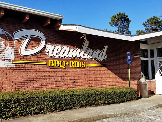 The brick exterior of Dreamland BBQ promises smoky treasures within, like a barbecue beacon calling hungry souls home.