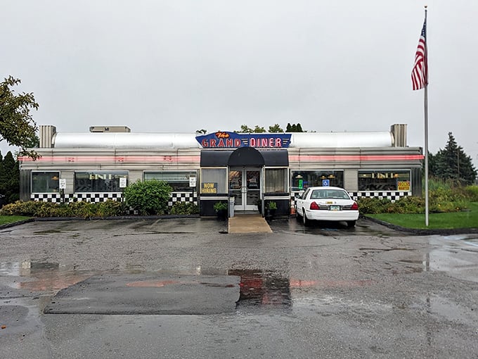The classic silver diner exterior gleams like a time machine to tastier days, complete with that iconic red and blue neon sign that practically screams "comfort food ahead!"