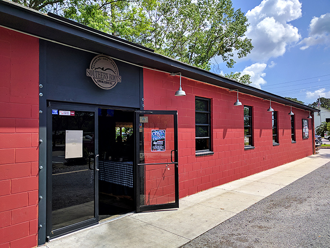 The bright red exterior of Southern Roots Smokehouse stands out like a beacon for barbecue pilgrims. Simple, unpretentious, and promising delicious things inside.