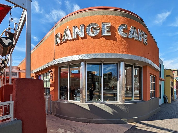 The unmistakable orange glow of Range Cafe's downtown location stands like a beacon for hungry souls on Central Avenue. Architectural personality with a side of breakfast promise.