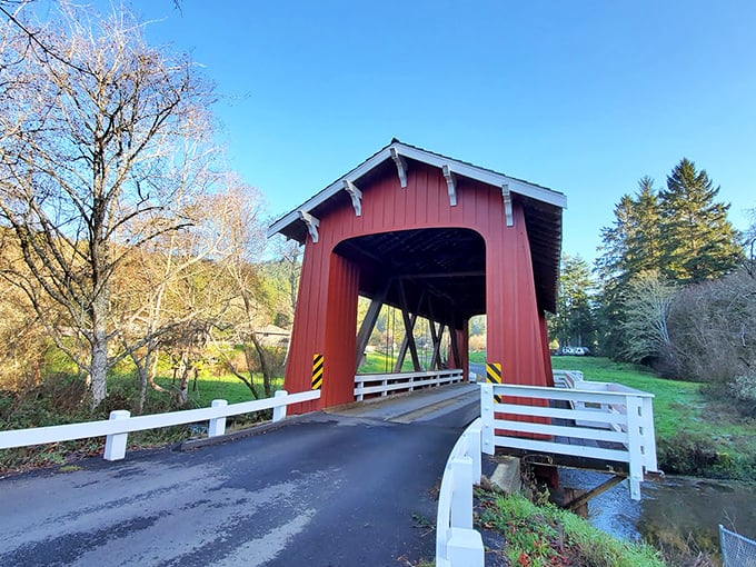 The crimson guardian of Bayside stands proudly against a perfect California sky, inviting travelers to slow down and experience a slice of architectural history.