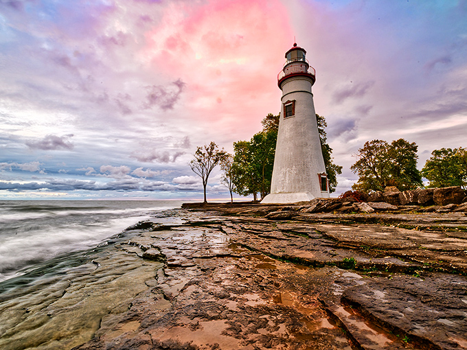 The Marblehead Lighthouse stands majestically against a cotton candy sky, proving Ohio can deliver coastal magic that rivals any New England postcard.