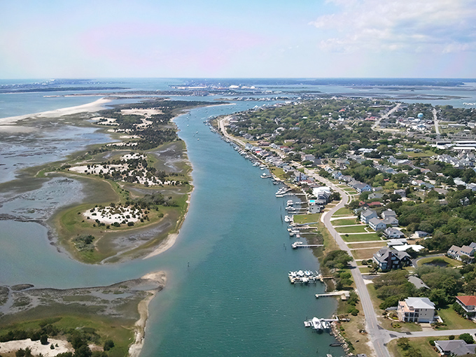 Beaufort's waterfront stretches like nature's welcome mat, where boats bob in greeting and marshlands whisper secrets of coastal living.