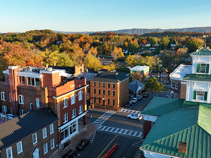 Abingdon's autumn palette transforms the Blue Ridge backdrop into nature's masterpiece. Brick buildings and green rooftops create a postcard-perfect scene that begs to be framed.