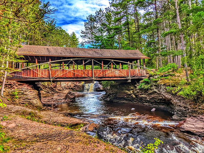 Nature's masterpiece in motion: Amnicon Falls carves through ancient basalt rock, creating a mesmerizing dance of water and stone that changes with every season.