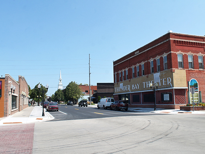 Downtown Alpena welcomes you with classic brick buildings and the iconic Thunder Bay Theater, where small-town charm meets cultural sophistication.