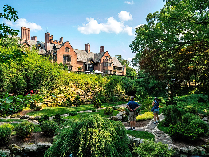 The grand Tudor Revival mansion rises above meticulously landscaped gardens like Ohio's answer to Downton Abbey, minus the British accents and family drama.