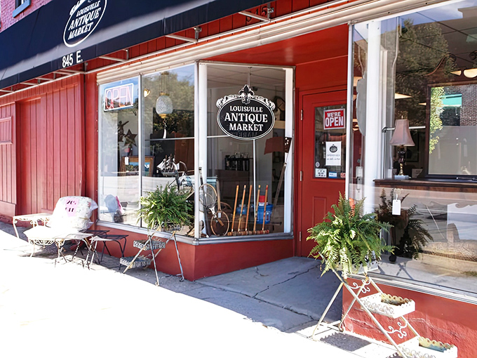 The red-brick storefront of Louisville Antique Market invites treasure hunters inside, where vintage charm and hidden gems await around every corner.