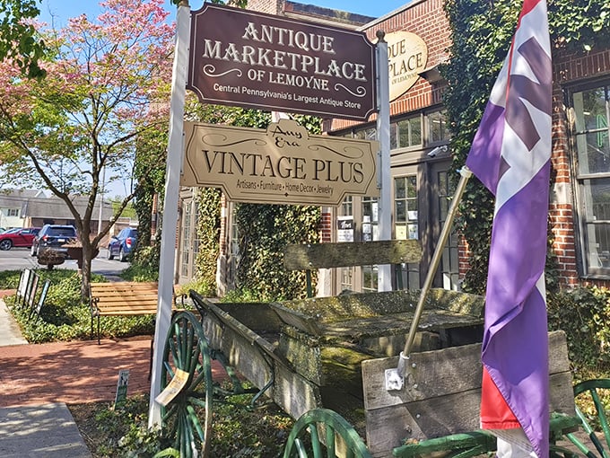 Welcome to treasure hunter's paradise! The rustic wagon wheel and blooming trees frame this antique wonderland like nature's own invitation to step back in time.