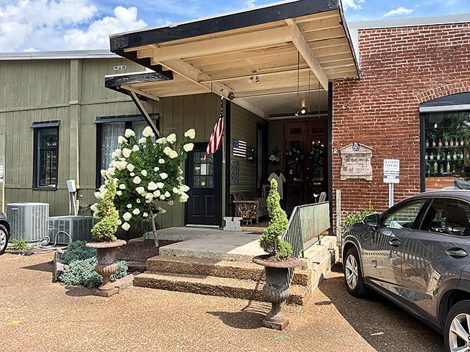 The welcoming entrance of Franklin Antique Mall beckons with lush hydrangeas and classic architecture &ndash; like a Southern grandmother inviting you in for sweet tea and stories.