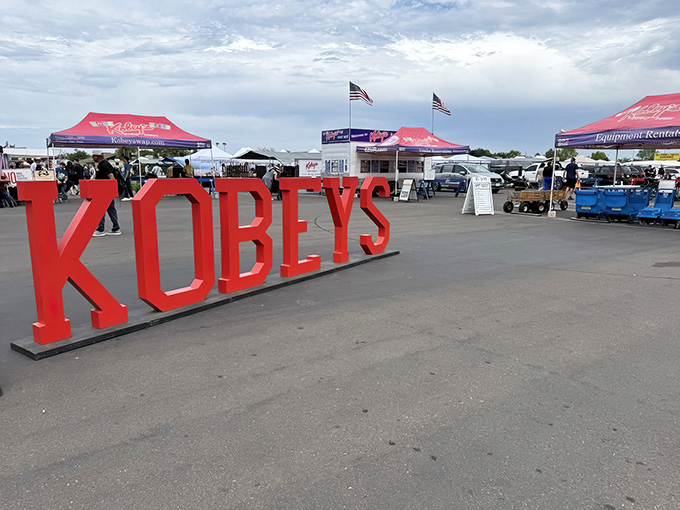 The iconic red KOBEY'S letters stand like sentinels at the entrance, promising treasure hunting adventures under San Diego's perfect blue skies.