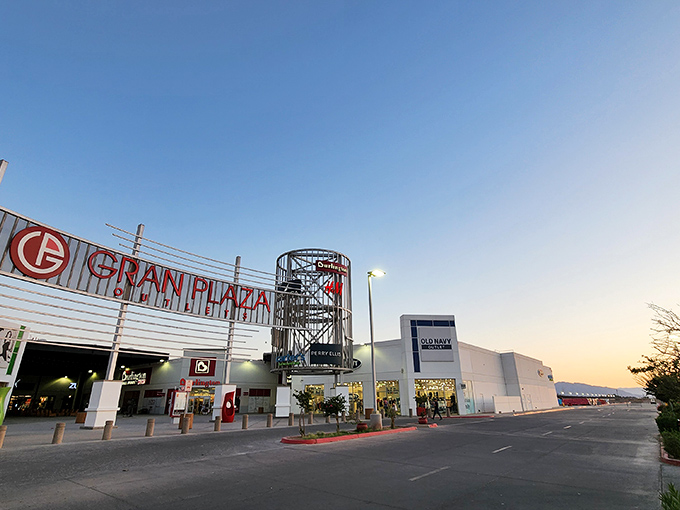 Sunset shopping takes on a magical quality as Gran Plaza's architectural features glow against the desert twilight, transforming an outlet mall into a retail landmark.