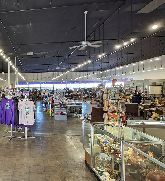 Treasure hunters navigate aisles of possibility under industrial chic lighting. This isn't just shopping&mdash;it's an archaeological expedition for modern bargain seekers.