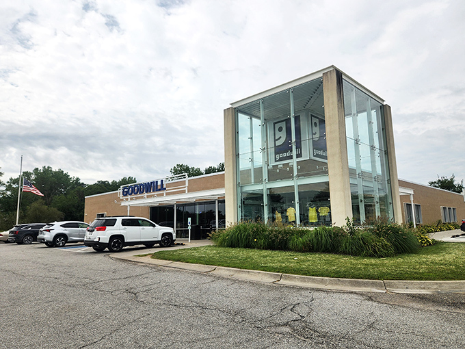 The architectural statement piece of Bellevue's Goodwill – where that glass tower entrance practically winks at bargain hunters like a beacon of thrifty possibility.