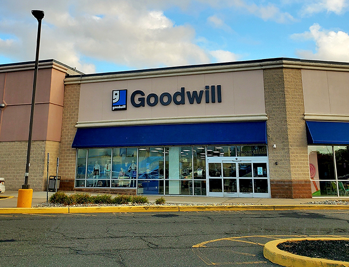 The blue awning beckons like a beacon of budget-friendly brilliance in suburban New Jersey shopping paradise.