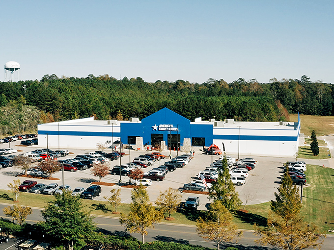 The blue-and-white fortress of frugality stands proudly against the Alabama sky, a beacon calling to bargain hunters from miles around.