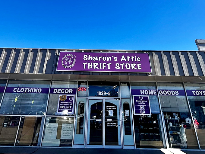 The purple sign beckons like a siren call to bargain hunters. Sharon's Attic Thrift Store's modest exterior hides a treasure trove waiting to be discovered.